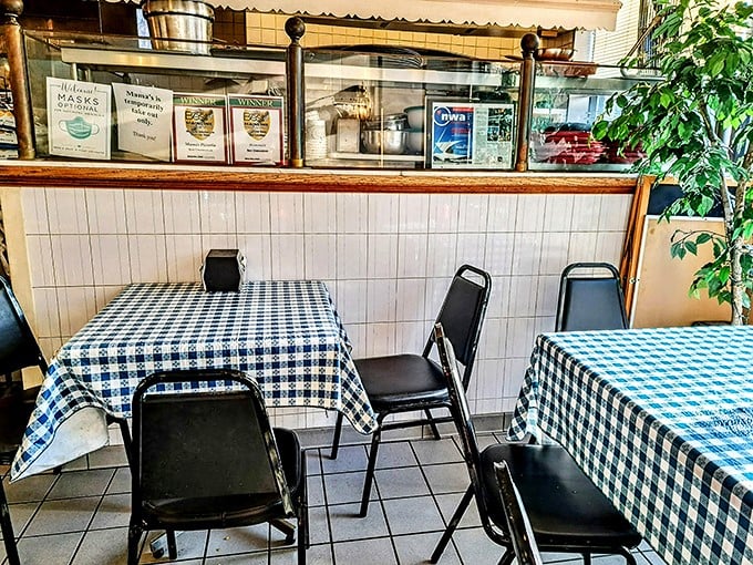 Blue checkered tablecloths and simple chairs tell you everything you need to know - this place cares about food, not fancy furniture.