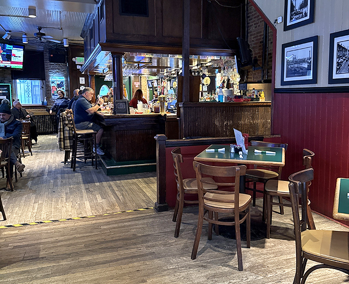 Inside, worn wooden floors and red wainscoting create that perfect Baltimore alchemy &ndash; equal parts comfort, character, and neighborhood charm.