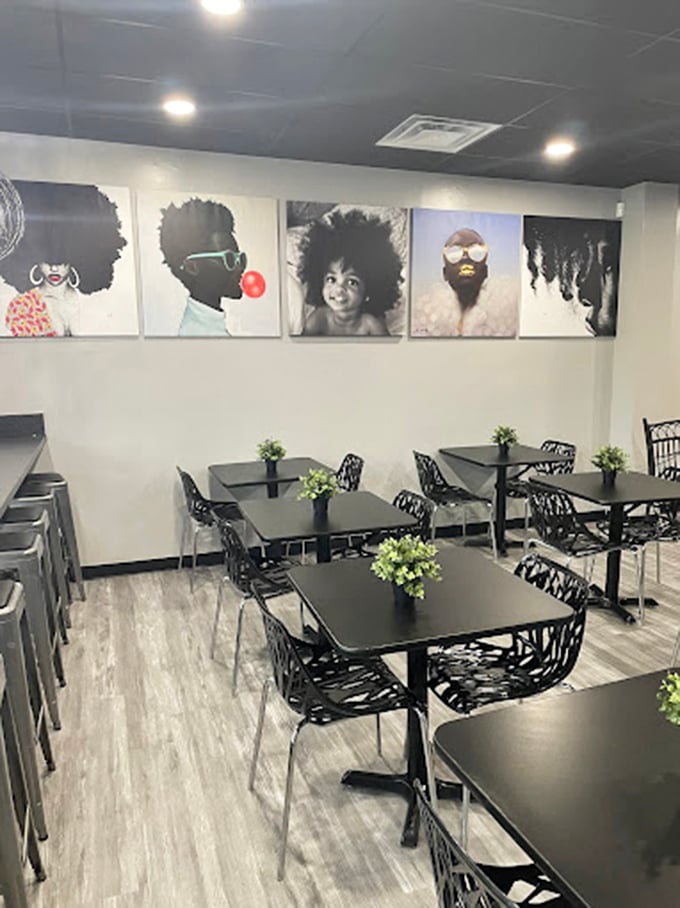 Modern meets homey in this stylish dining area, where striking portrait art creates an atmosphere that's both trendy and comfortable.