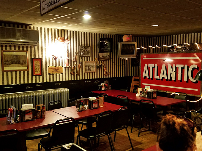 Inside, black and white striped wallpaper meets vintage decor, creating that perfect "I've discovered somewhere special" feeling that makes a roadhouse truly authentic.