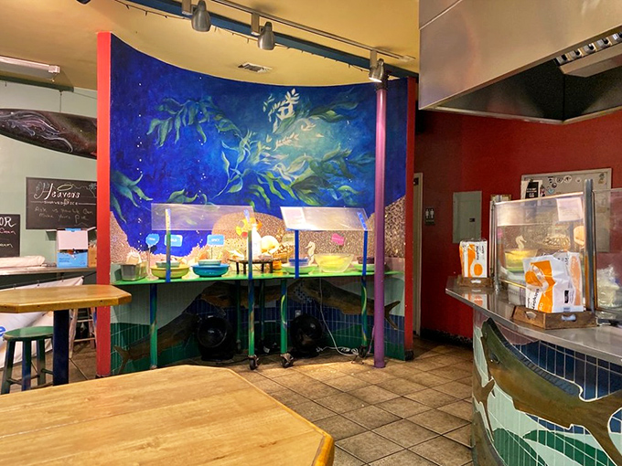 The vibrant underwater mural makes you feel like you're dining beneath the sea&mdash;appropriate considering what's about to land on your plate.