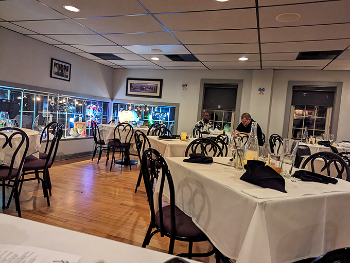 White tablecloths and elegant place settings create an atmosphere that's both refined and comfortable. The perfect backdrop for memorable Italian feasts.