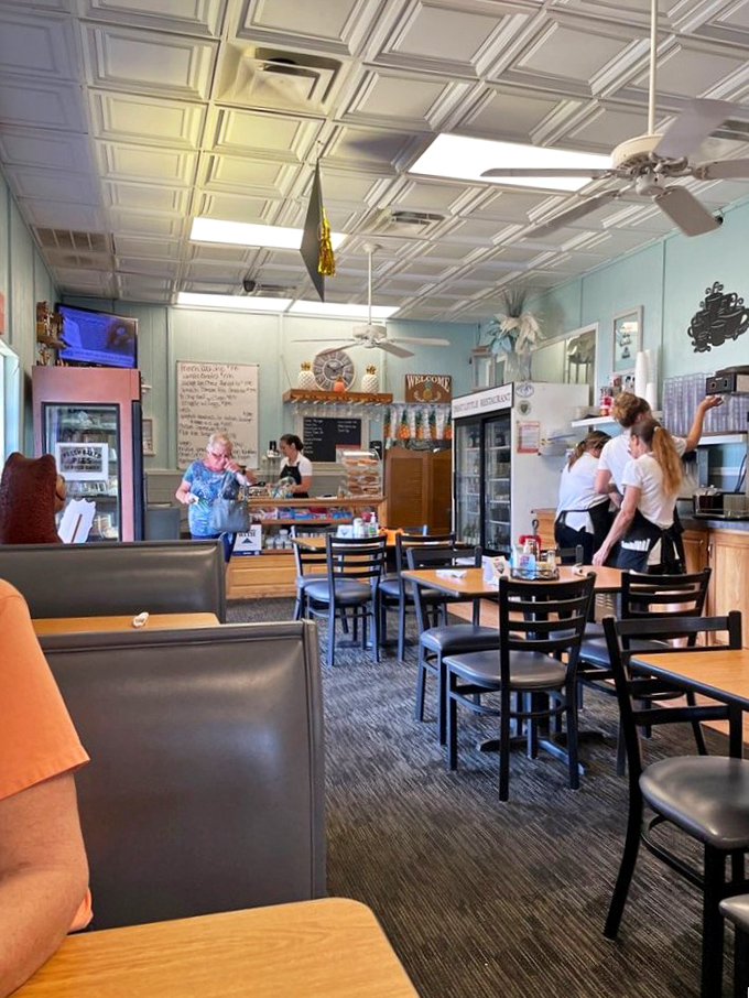Inside, aqua walls and classic ceiling tiles create that perfect diner atmosphere where calories don't count and coffee refills are practically mandatory.