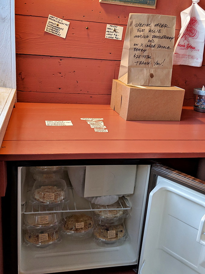The refrigerator reveals its treasures like a bank vault of sweetness. In the pie economy, these plastic containers are worth their weight in gold.