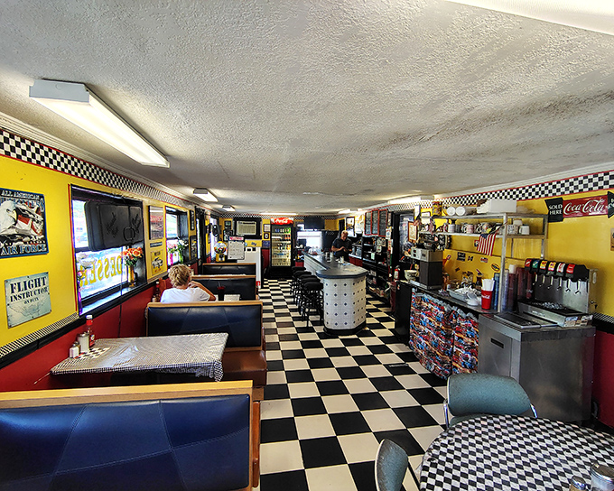 Classic checkered floors meet sunny yellow walls in this time capsule of American diner culture. The kind of place where memories are made between coffee refills.