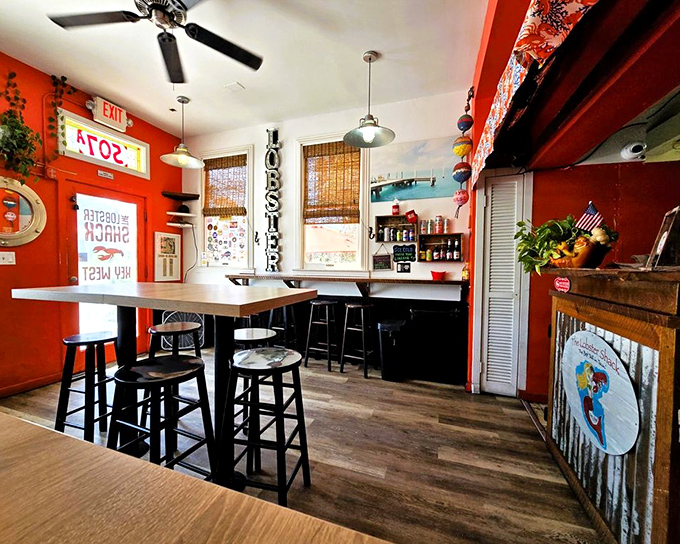 Step inside and the vibrant coral-red walls embrace you like a warm hug from your favorite seafood-loving aunt.