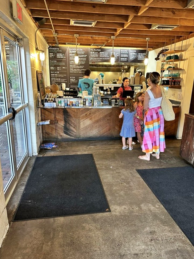 Step inside to seafood simplicity at its finest. The ordering counter welcomes hungry visitors with a menu that promises ocean-fresh delights without pretension.