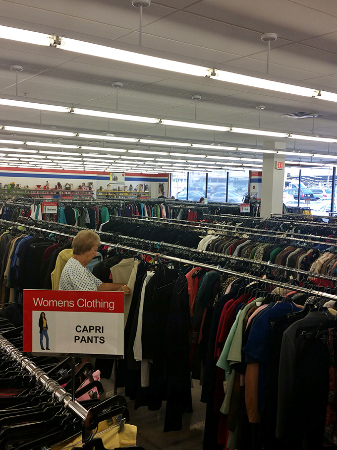 Rows upon rows of clothing stretch toward the horizon, a textile ocean where fashion castaways find new life and purpose.
