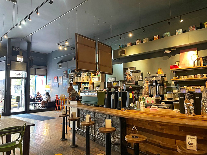 Inside, wooden countertops and vintage-inspired lighting create the perfect backdrop for serious coffee craftsmanship. The kind of place where beans and nostalgia are equally respected.