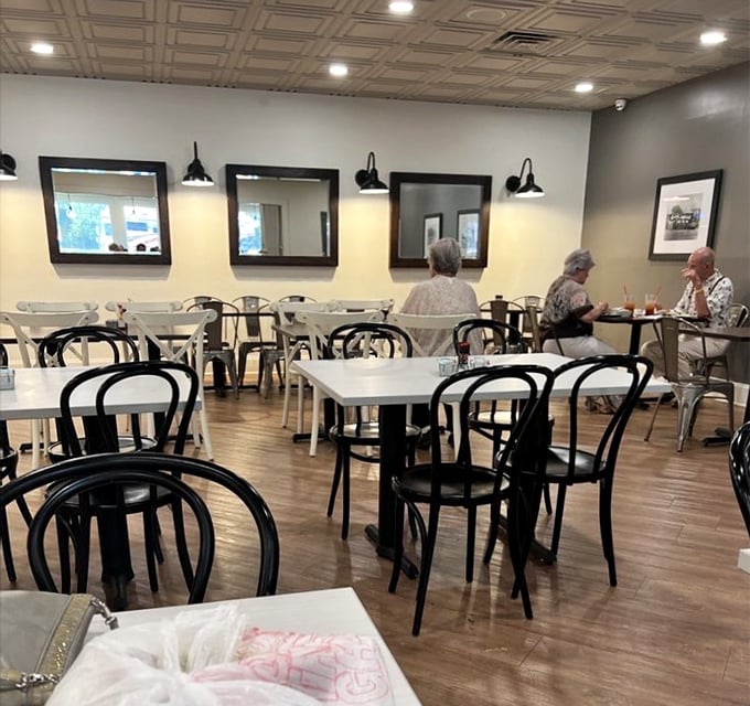 Black bentwood chairs and pressed tin ceilings create that perfect nostalgic atmosphere. Like stepping into your favorite childhood memory, but with better food.