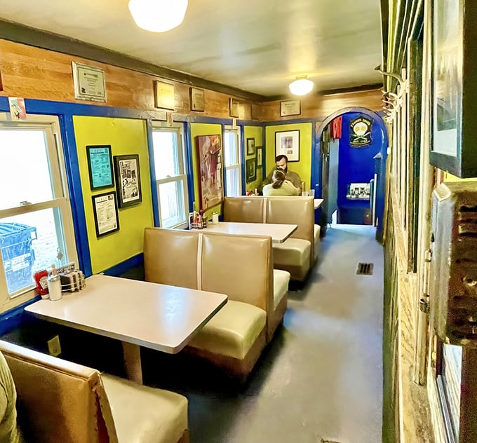 Step into this cozy time capsule where yellow walls and classic booths create pure diner nostalgia.