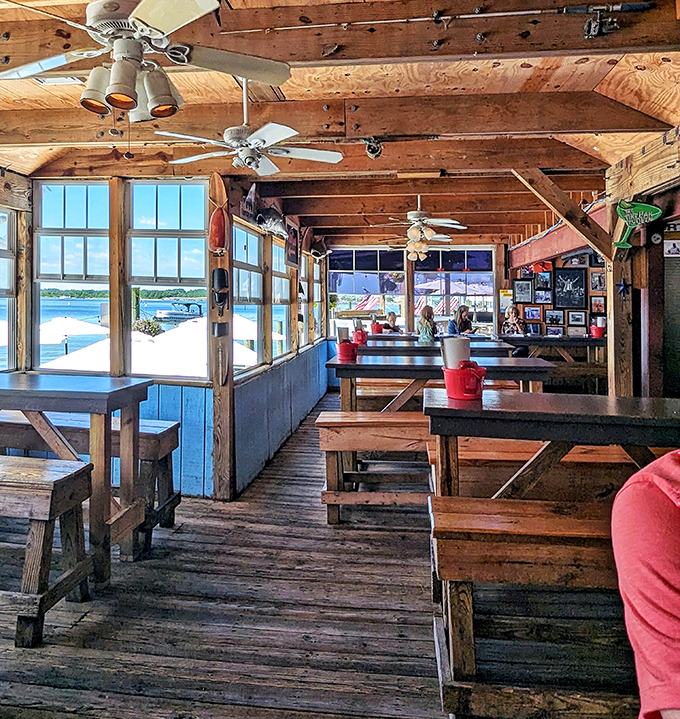 Rustic wooden beams frame waterfront views that rival the food for attention. This isn't just dining&mdash;it's coastal Virginia's living room.