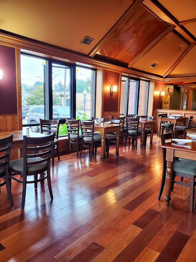 Warm wood tones and natural light create the perfect dining sanctuary. This is where conversations flow as easily as the Guinness.