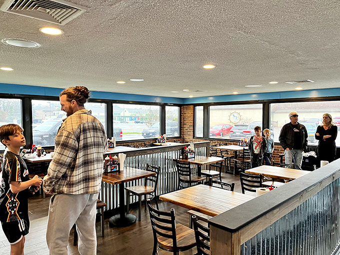 Inside, the simple blue-trimmed dining room with corrugated metal accents keeps the focus where it belongs&mdash;on the magnificent meat about to grace your table.