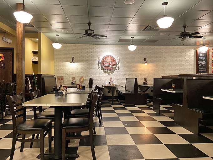 Classic black and white tiles play chess with your feet while wooden booths stand ready for the serious business of eating well.