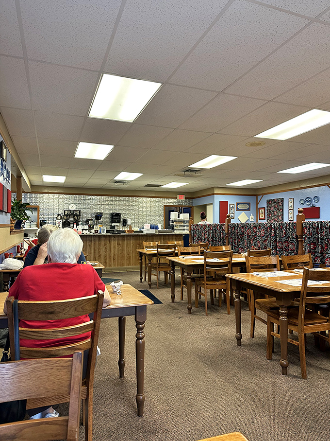Wooden tables, simple chairs, and Danish decor create that rare atmosphere where calories don't count and coffee refills flow freely.