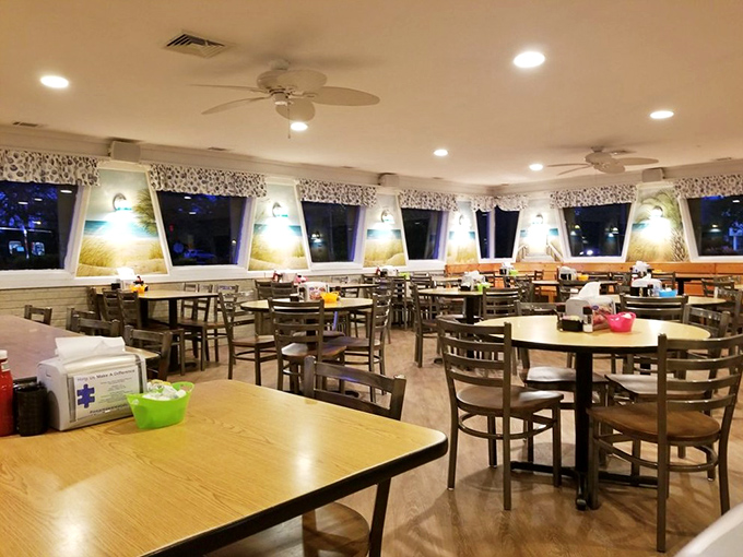 Inside Johnny D's, wooden tables and warm lighting create that perfect "stay awhile" atmosphere where breakfast dreams and vacation stories unfold.