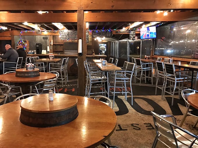 The interior says "no-nonsense barbecue joint," but those barrel tables whisper "we take our craft seriously enough to repurpose bourbon barrels as furniture."