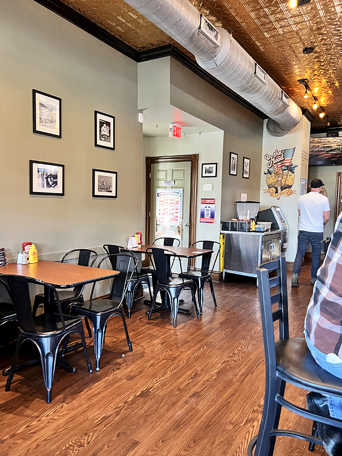 Inside, the pressed tin ceiling and industrial-chic decor create the perfect backdrop for the serious burger business happening in the kitchen.