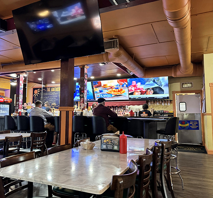 Inside, exposed ductwork and straightforward seating create that rare atmosphere where the food, not the decor, does all the talking. The kind of place where calories don't count and conversations flow freely. 