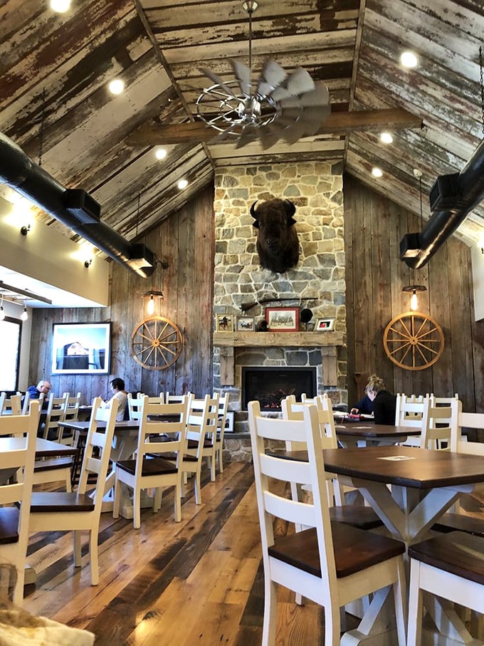 Rustic elegance defines Hood's interior, where weathered wood, wagon wheels, and that magnificent stone fireplace create an atmosphere as comforting as the food itself.