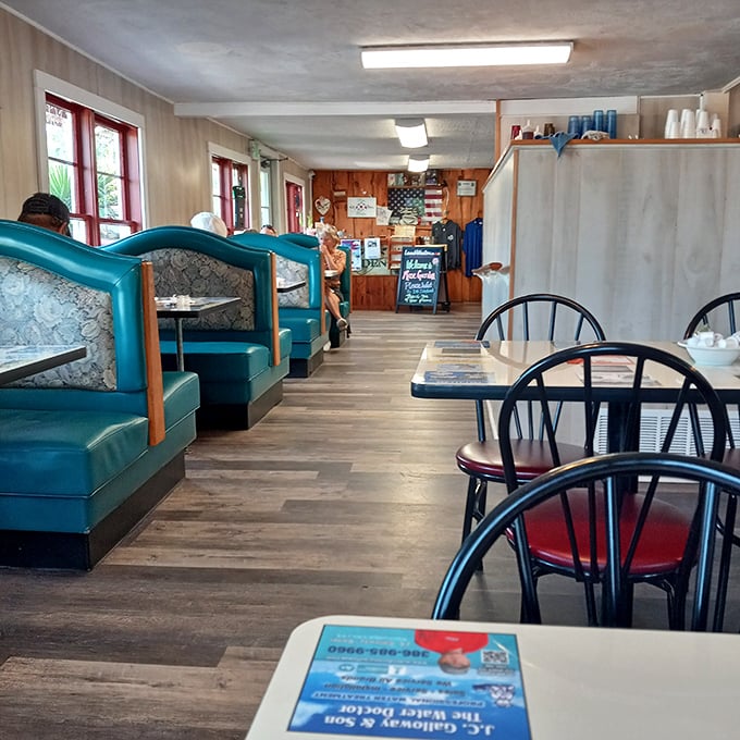 Classic turquoise booths line the wood-paneled interior, creating that perfect small-town diner atmosphere where breakfast dreams come true.