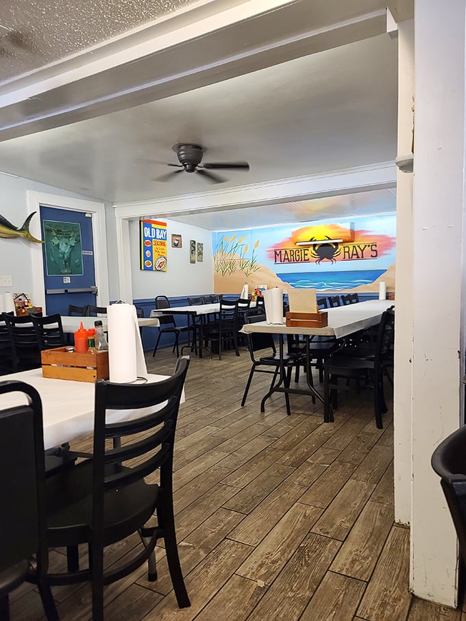 Simple wooden floors and beach-themed murals tell you immediately: this place prioritizes what's on your plate, not what's on the walls.