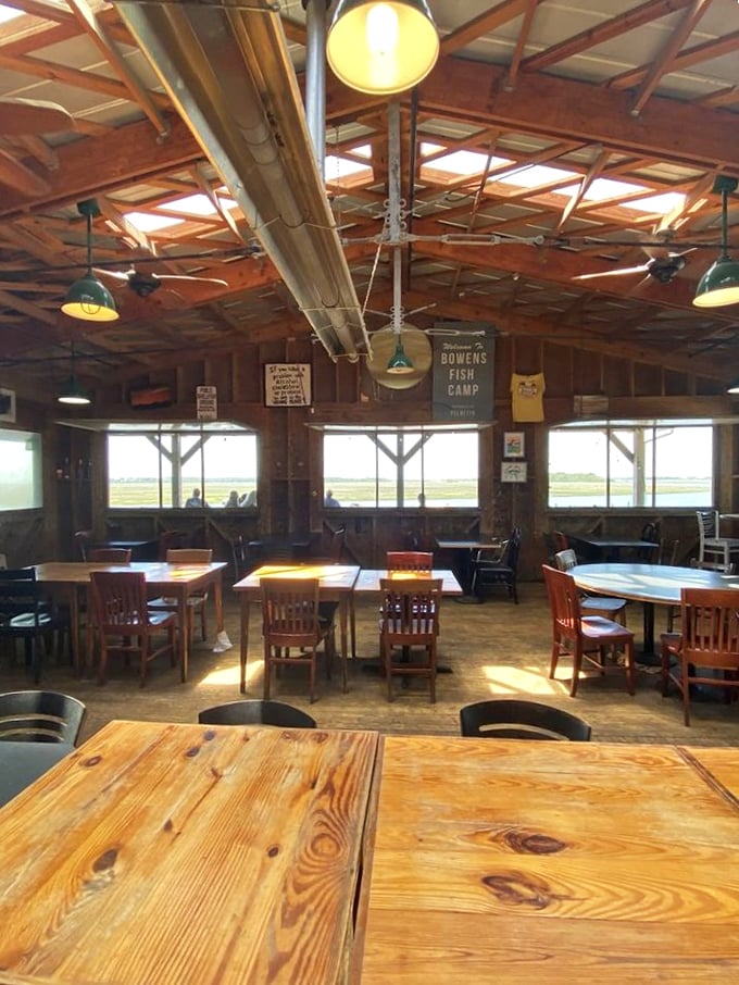 Wooden tables with marsh views that'll make you forget your phone exists. The real social network happens over platters of seafood here