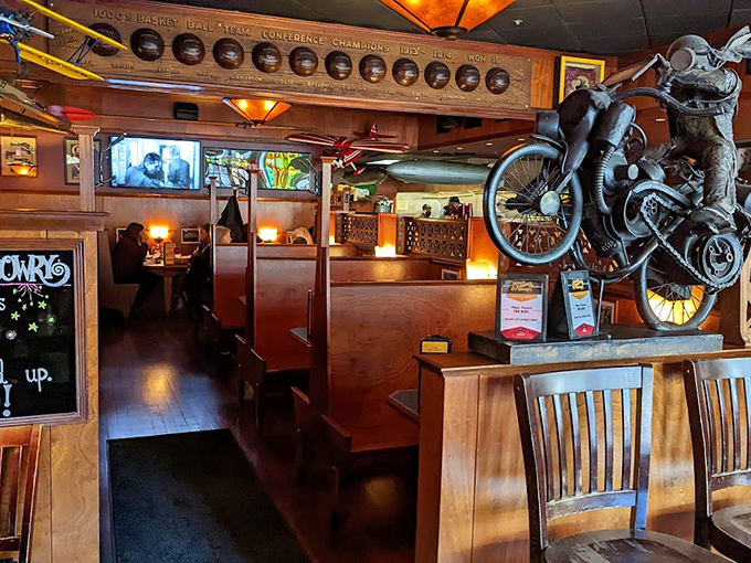 Step inside and you're greeted by warm wood, quirky decor, and a motorcycle that somehow found its way to the ceiling. 
