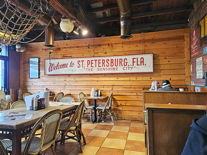 Warm wooden paneling and that iconic "Welcome to St. Petersburg" sign create the perfect backdrop for seafood-induced happiness.