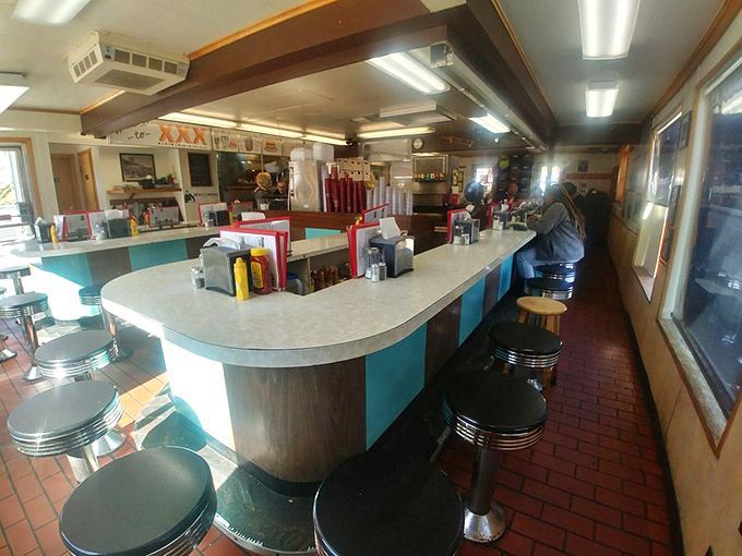 The horseshoe counter isn't just nostalgic design&mdash;it's where strangers become friends over coffee and where breakfast dreams come true at any hour.