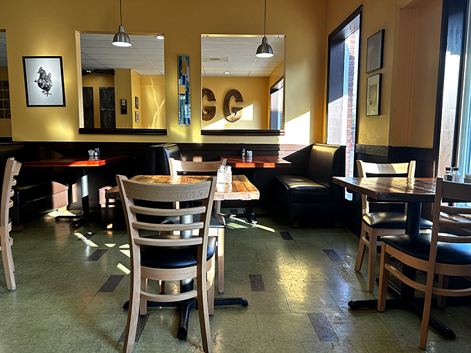 Sunshine streams through windows into this cozy dining space where wooden tables await the morning's parade of perfectly executed breakfast classics.