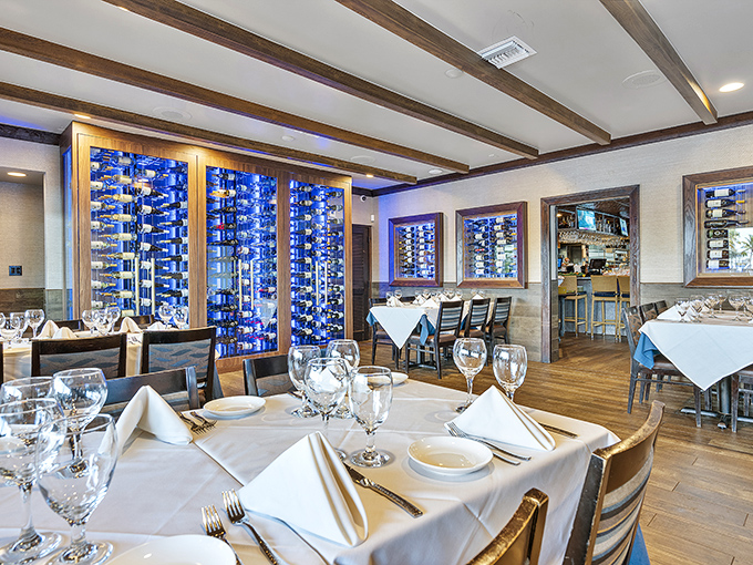 Wine walls that double as art installations? Yes, please! The elegant dining room balances upscale ambiance with Florida's relaxed coastal charm.