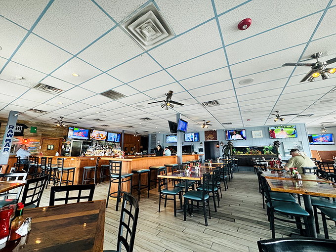 Inside, the perfect marriage of sports bar energy and seafood joint authenticity creates that rare atmosphere where both locals and tourists feel instantly at home.
