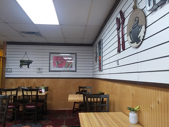 Simple wooden paneling and homey decor create that perfect diner atmosphere where calories don't count and coffee refills flow freely.