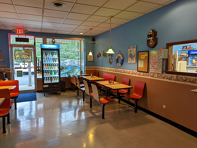 Nautical blue walls and bright orange booths create the perfect backdrop for seafood feasting. This no-frills dining room says, "We're serious about seafood, not interior design magazines."