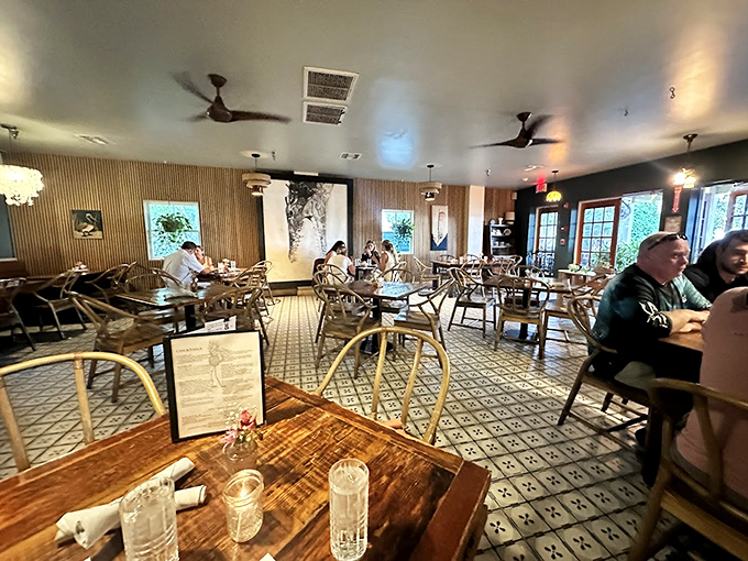 Inside, wood-slat walls and patterned tile floors create a space that feels both modern and timeless&mdash;like your coolest friend's dining room.