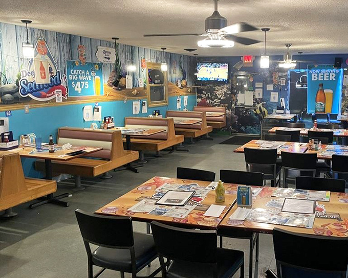 Classic diner-style booths meet nautical charm in this no-frills dining room. The decor says "we're serious about seafood, not interior design."