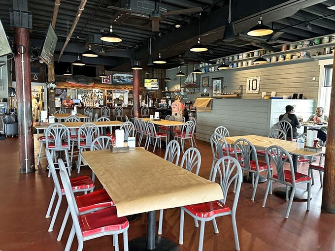 Where crab dreams come true. Simple wooden tables and nautical-inspired chairs create the perfect backdrop for the seafood drama about to unfold.