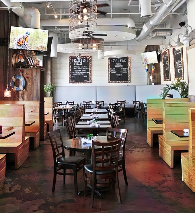 Industrial-chic meets maritime charm in this airy dining room where chalkboard menus promise fresh catches and wooden booths invite lingering conversations.