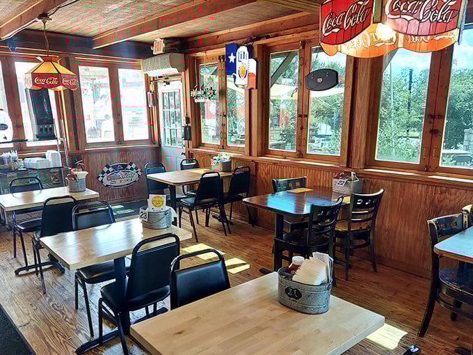 Sunlight streams through windows into this wood-paneled sanctuary of comfort food. The Coca-Cola signs aren't just decoration&mdash;they're a promise.