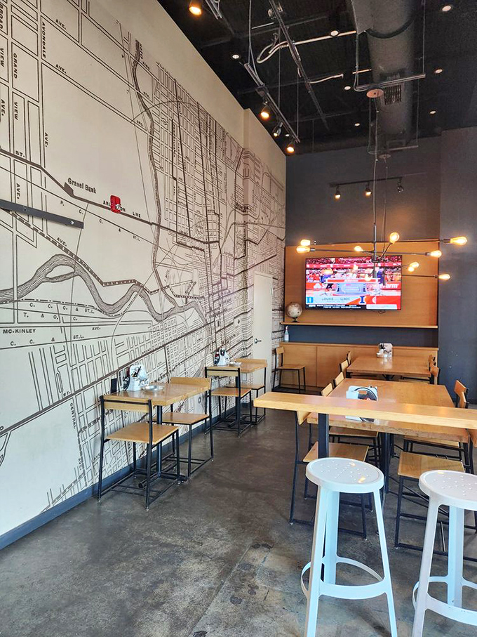 The wall-sized map isn't just decor&mdash;it's your invitation to explore Columbus after you've conquered your burger. Industrial-chic meets neighborhood warmth. 