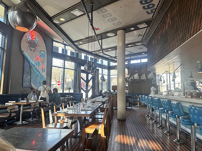 The interior blends shipshape elegance with casual comfort&mdash;wooden accents and blue chairs creating an atmosphere that says "serious seafood, zero pretension."