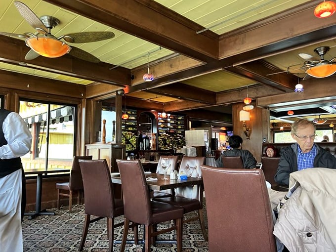 Rich wood beams, leather chairs, and those ceiling fans spinning lazily overhead&mdash;this isn't just dining, it's a maritime time capsule with table service.