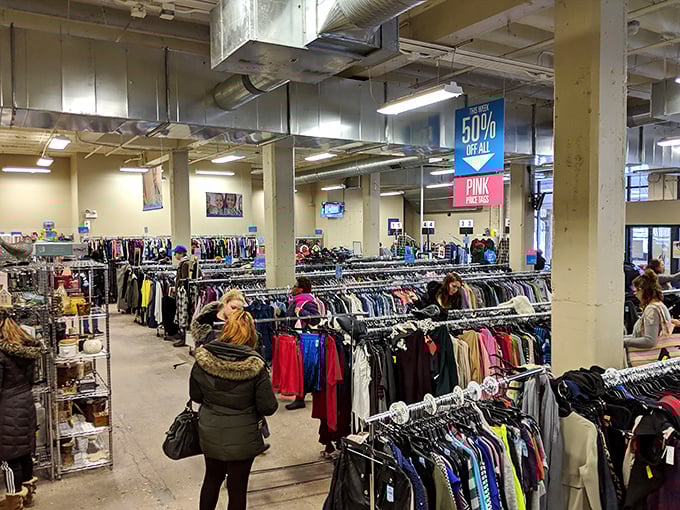 Endless racks stretch toward retail infinity, each hanger a question mark. What fashion gem might be hiding between that polka dot blouse and vintage cardigan?