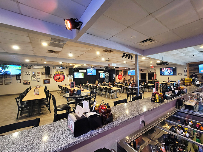 Inside, the spacious dining area offers a welcome surprise. The real spectacle isn't the TVs on the wall&mdash;it's what arrives on your tray.