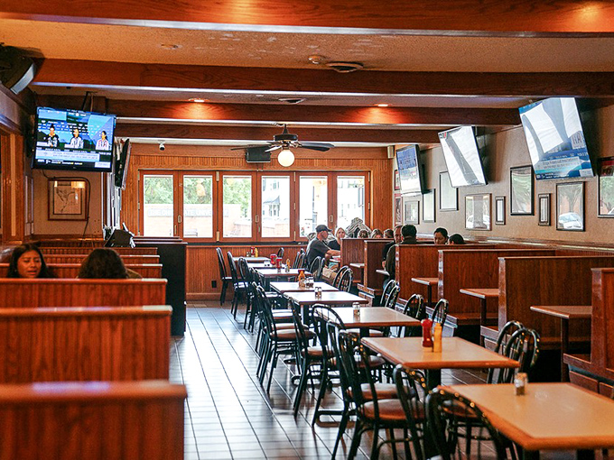 Wood paneling, comfortable booths, and strategically placed TVs&mdash;the sports bar trifecta perfected. The kind of place where memories are made between commercial breaks.