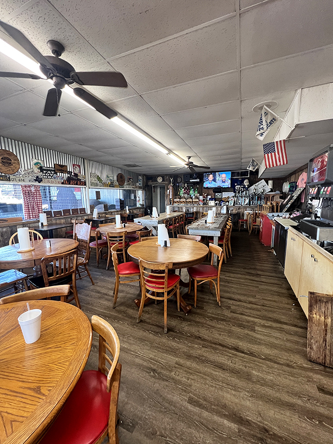 Where barbecue dreams come true. Simple wooden tables, red chairs, and an American flag create the perfect backdrop for the serious business of meat appreciation.