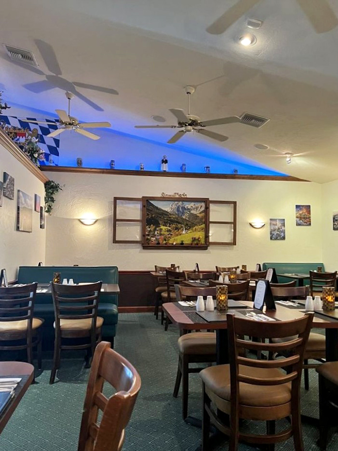 Blue ambient lighting and Bavarian d&eacute;cor transform this dining room into a slice of Munich. The ceiling fans are Florida's gentle reminder you're still in paradise.