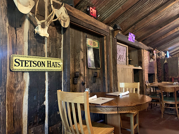 Cowboy hats and weathered wood create the perfect Texas tableau. This isn't d&eacute;cor from a catalog&mdash;it's authenticity you can feel in your bones.